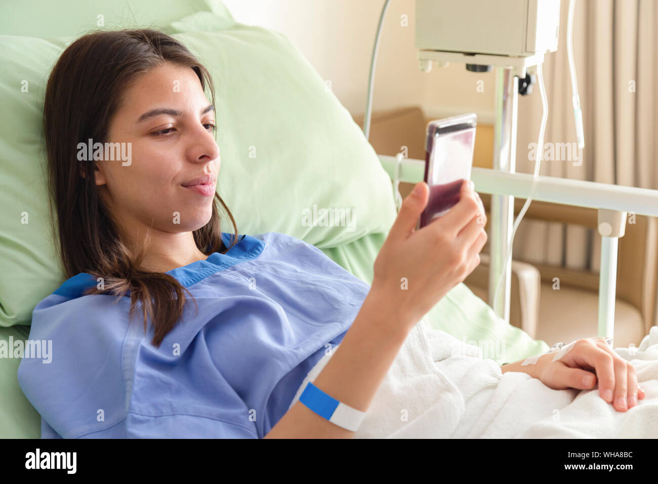Young Woman In Hospital Bed