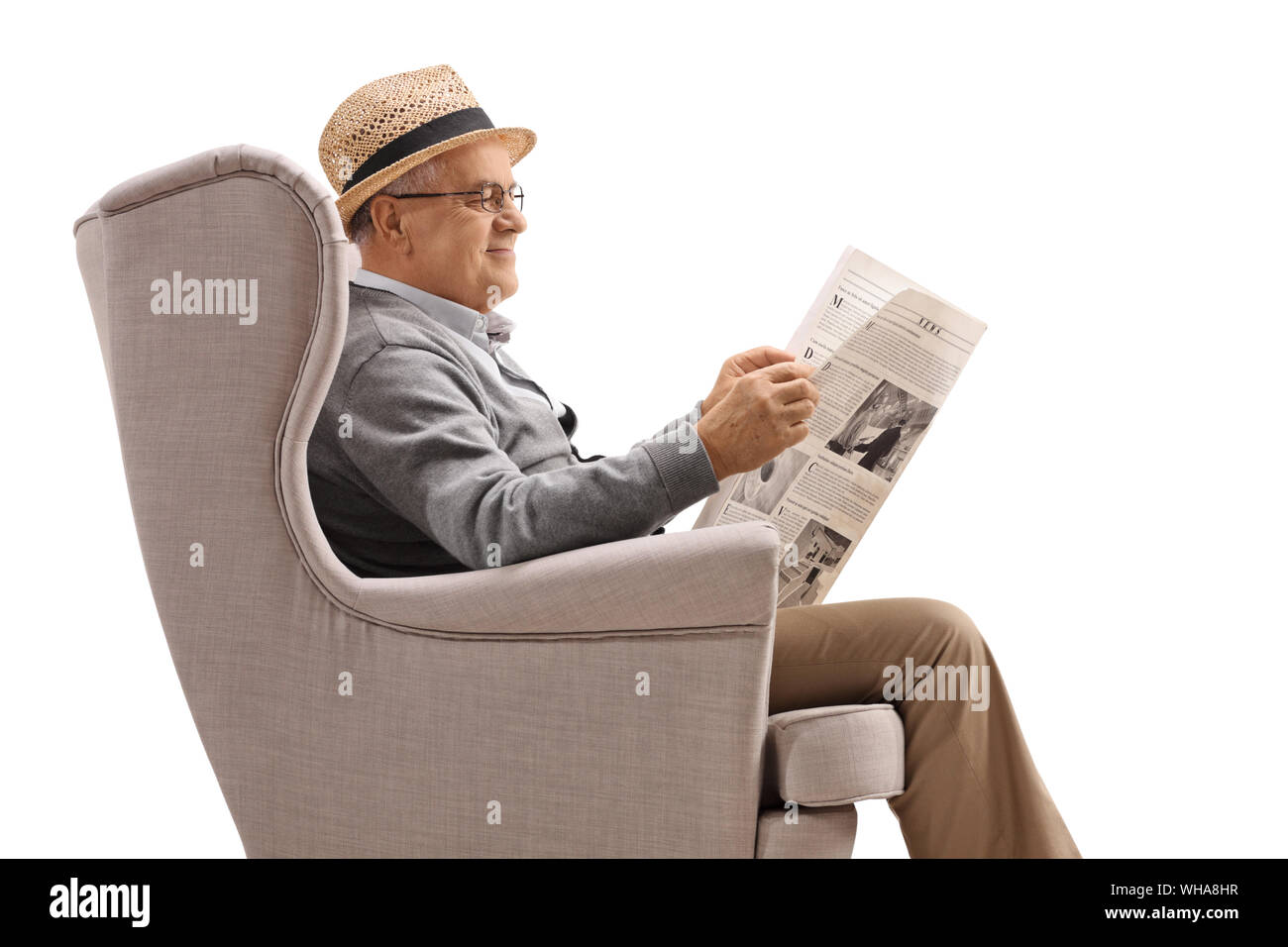 Man sitting on a chair reading a newspaper hi-res stock photography and ...