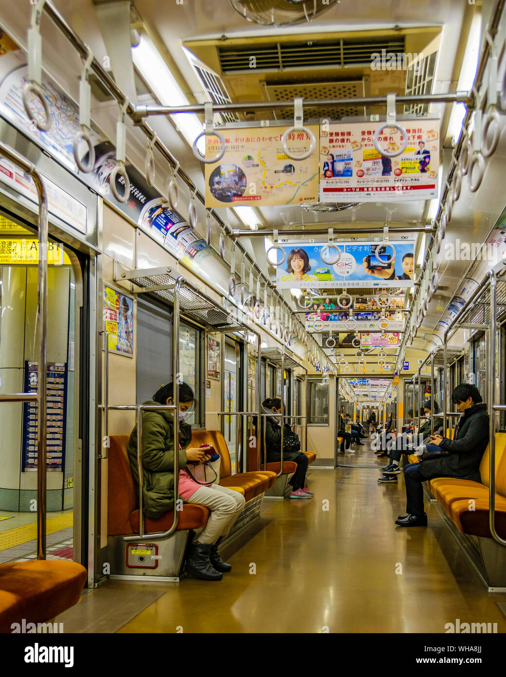 TOKYO, JAPAN, JANUARY - 2019 - Interior view of half empty subway train ...