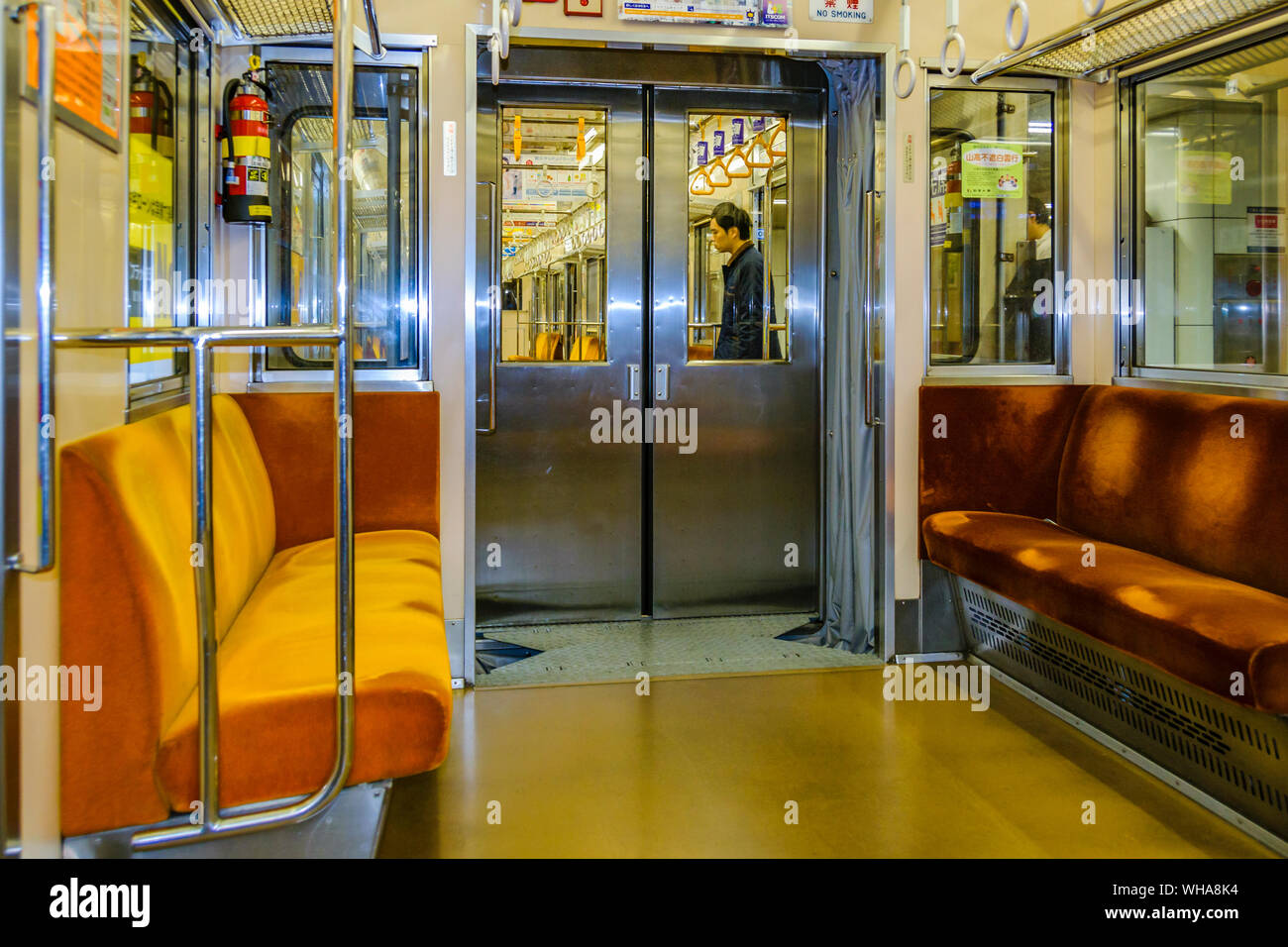 TOKYO, JAPAN, JANUARY - 2019 - Interior view of half empty subway train ...