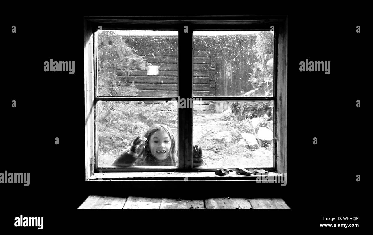 Girl through window Black and White Stock Photos & Images - Alamy