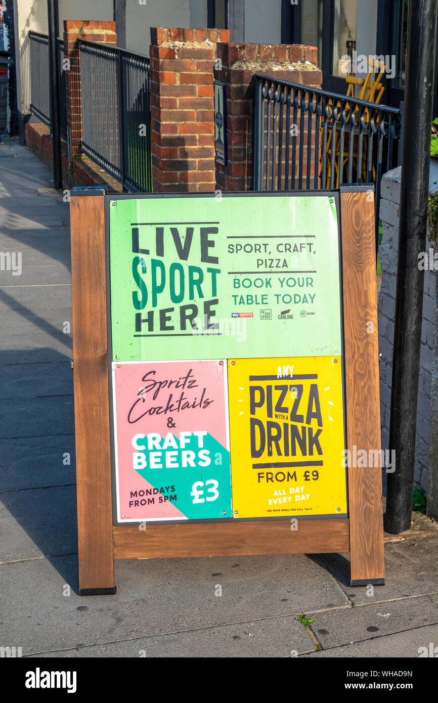 UK pub advertising sign on pavement Stock Photo - Alamy