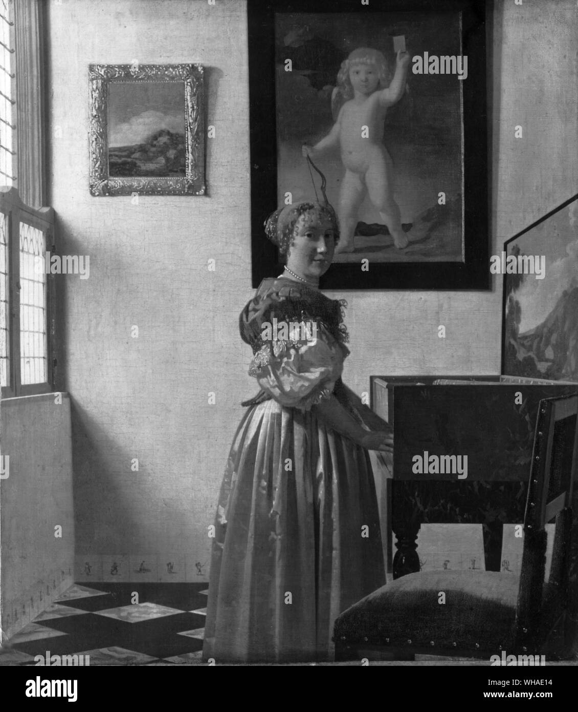 Vermeer. Young Woman standing at a Virginal. 1676 Stock Photo - Alamy