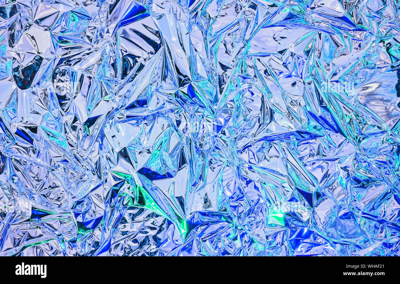 Aluminum foil with multi-colored illumination . Background and texture ...