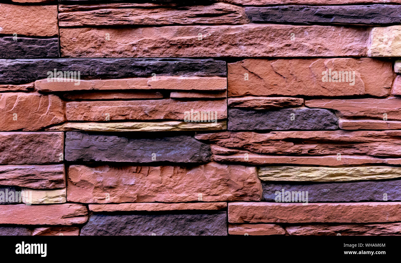 Texture of the stone wall. Panel of stones for finishing the facade of ...