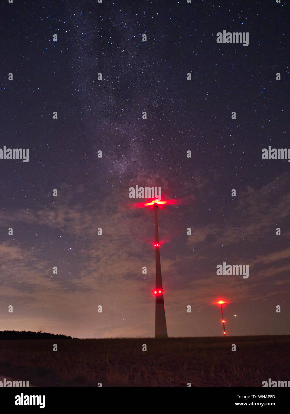 Wind turbines on the starry night sky with milkyway Stock Photo - Alamy