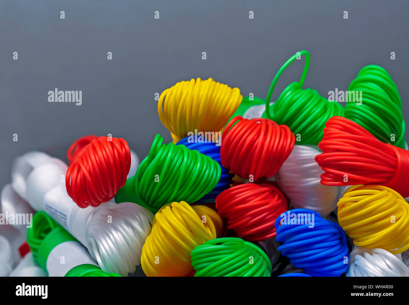 Colored plastic rope. Multicolored plastic wires in bundles Stock Photo ...