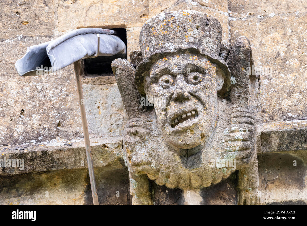 Medieval gargoyle on St Peters church (1465) in the Cotswold town of ...