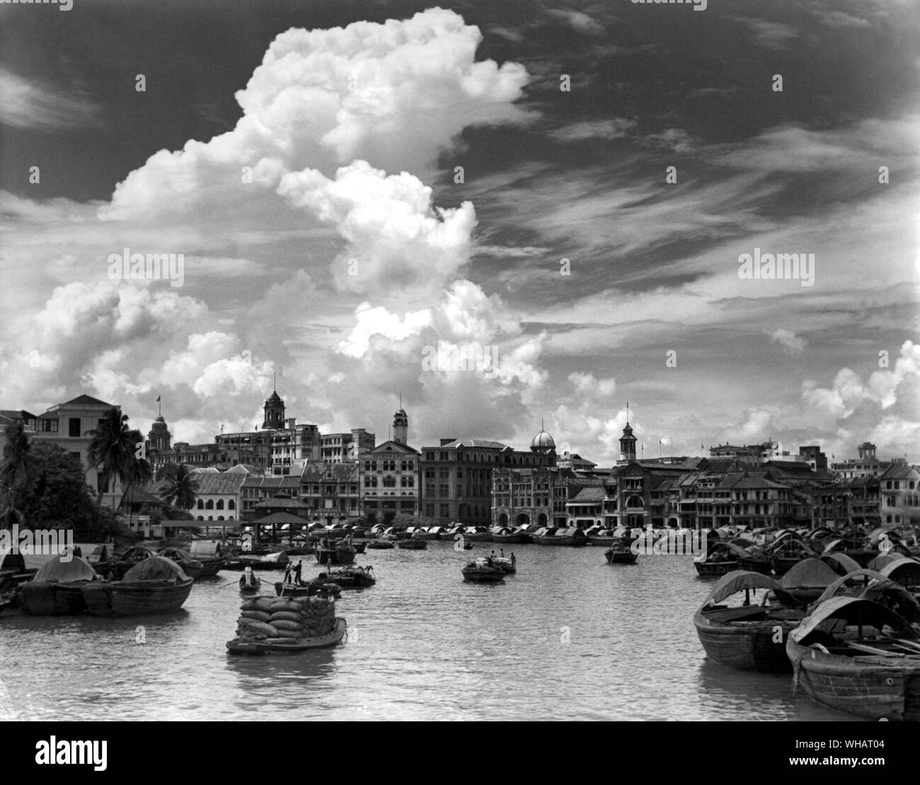 Sampans of Singapore. Along the waterfront of the British Naval ...