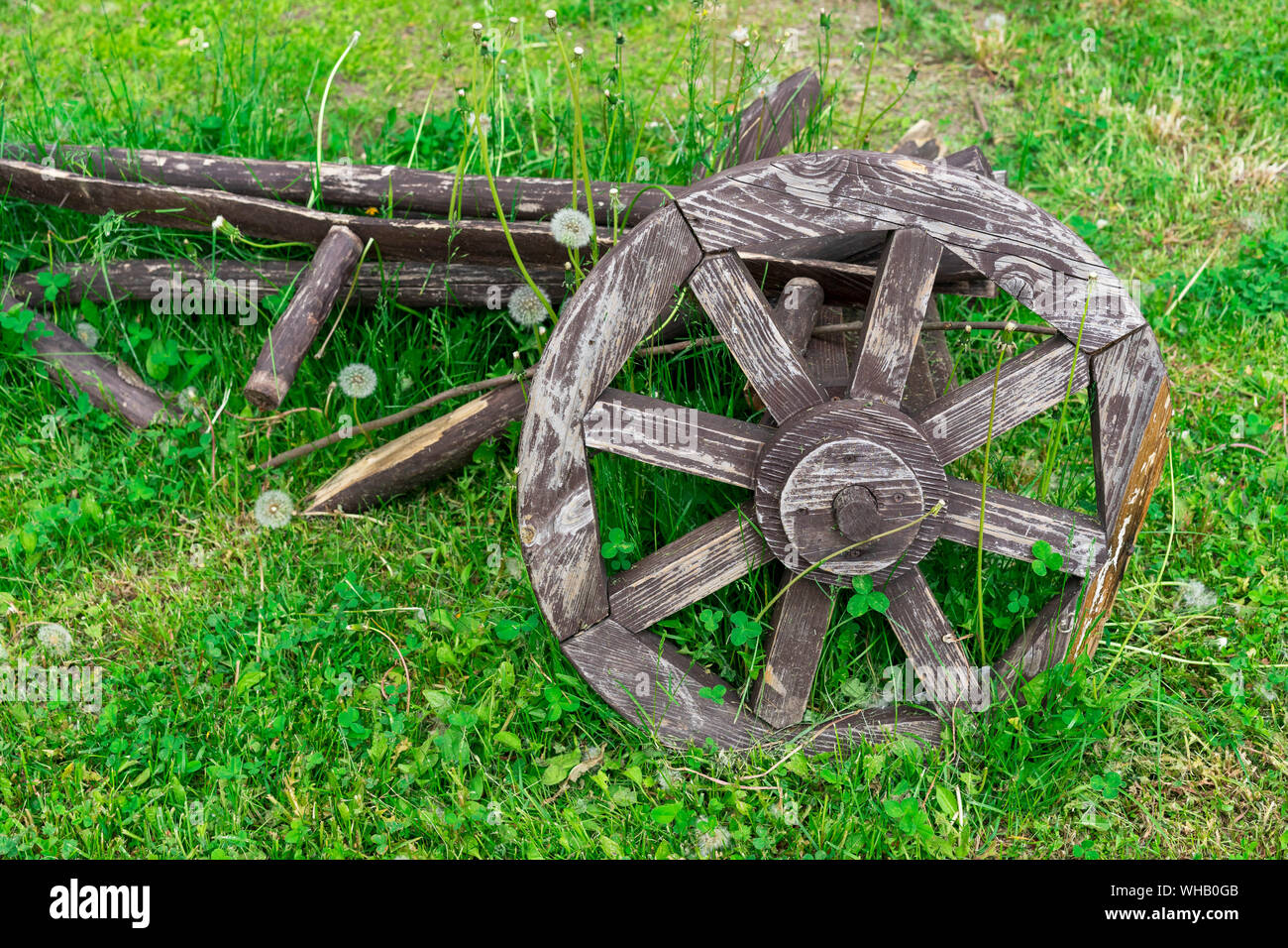 Old wooden cartwheel. Wheel from the old horse-drawn cart Stock Photo ...