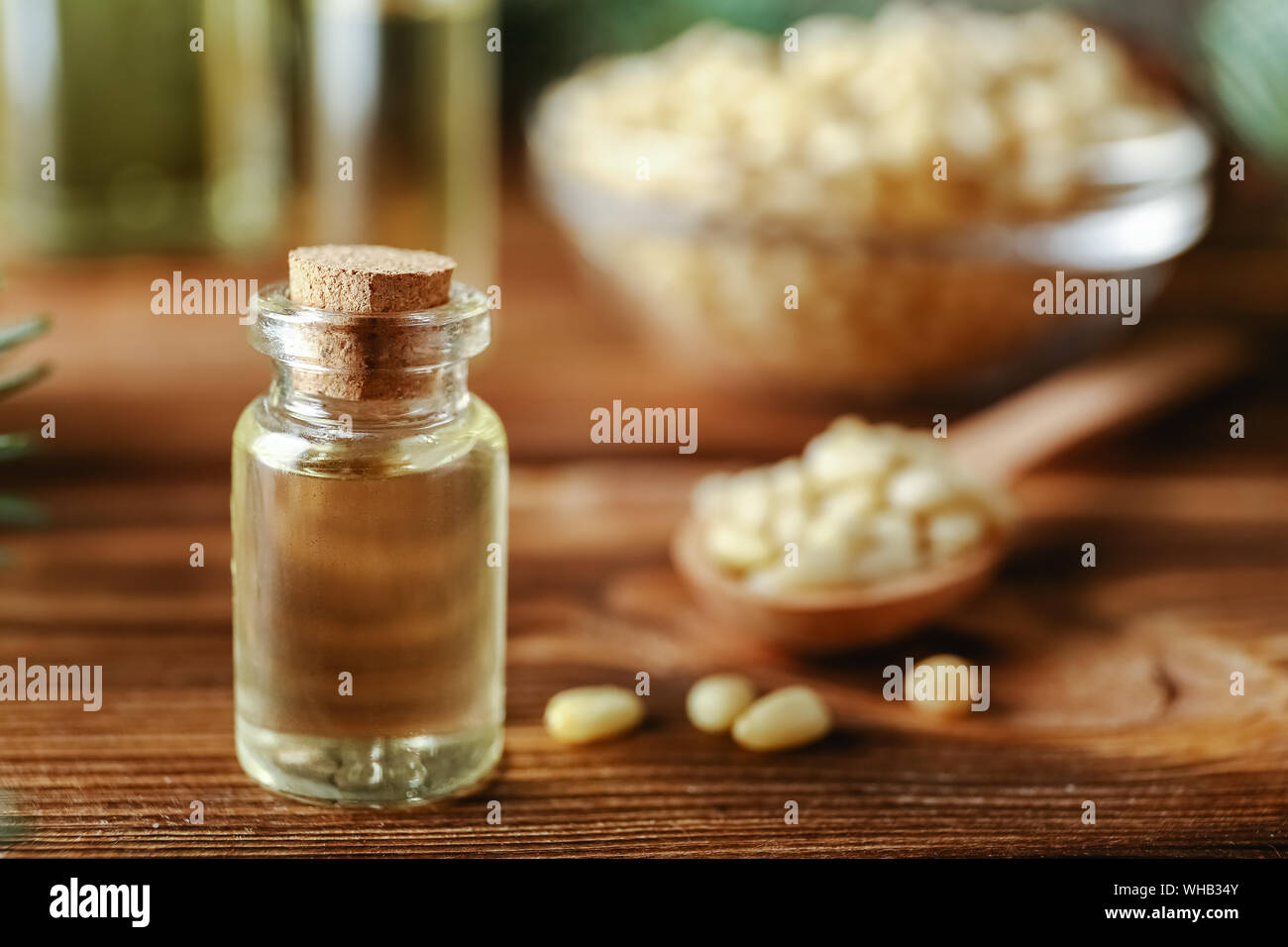 Pine nuts and bottles of essential oil Stock Photo - Alamy