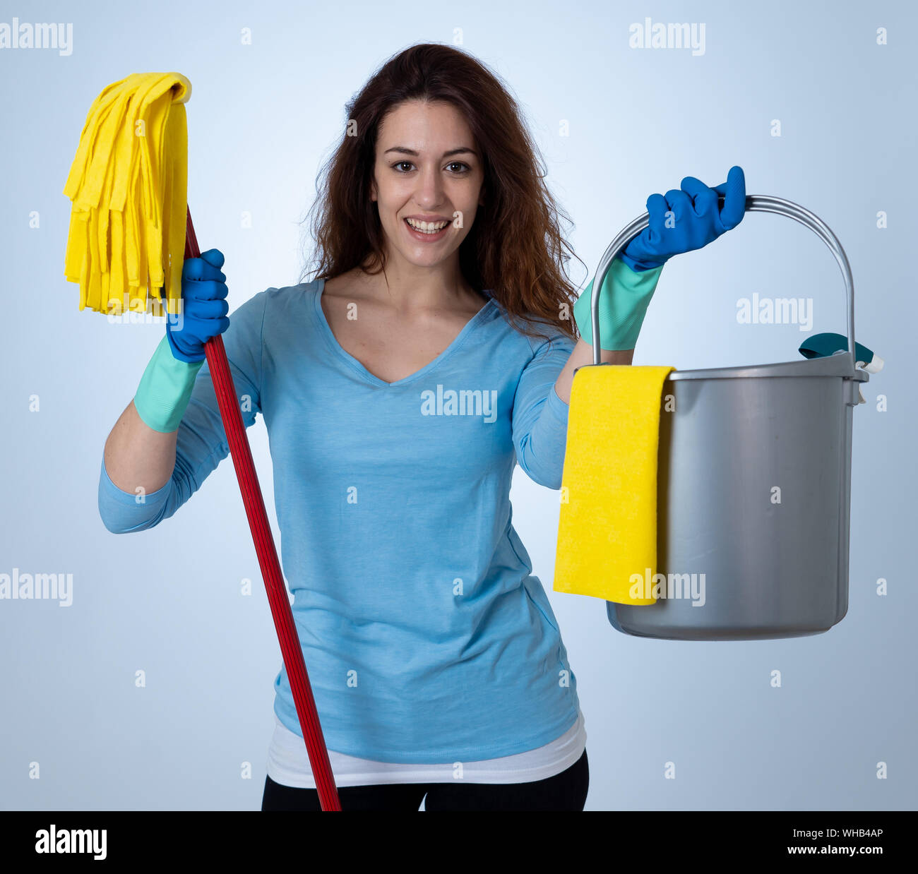 Beautiful happy housewife woman holding cleaning equipment. Proud women ...