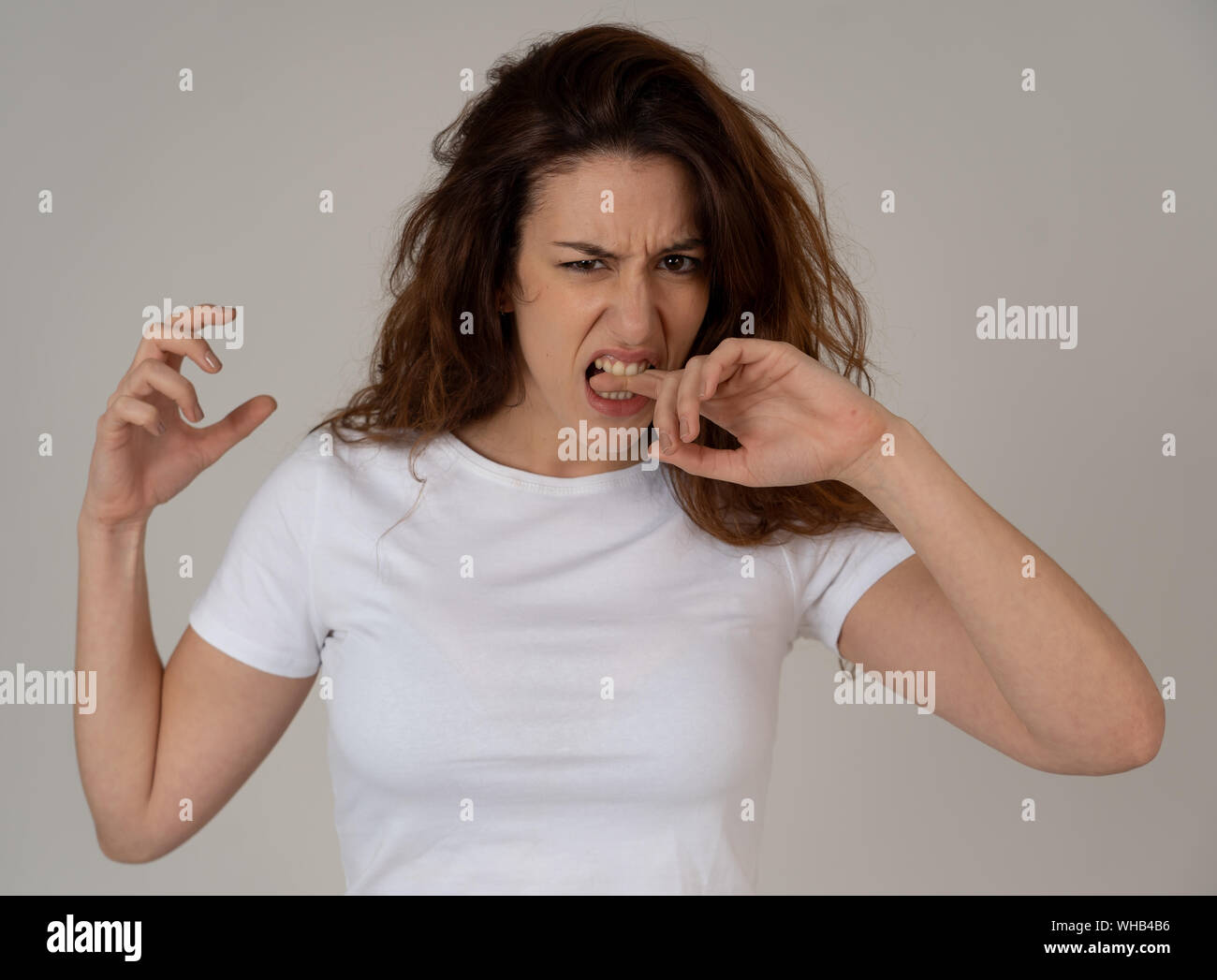 Young woman with red hair confused and displeased staring in disgust ...