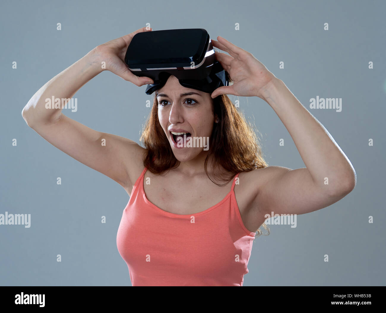 Virtual reality experience. Young caucasian happy woman about to use VR ...