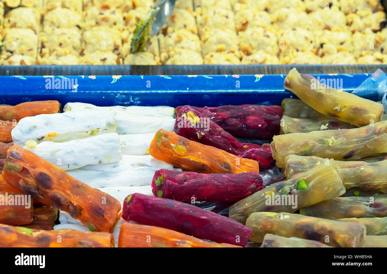 Traditional Turkish delight on the eastern bazaar. Oriental desserts ...