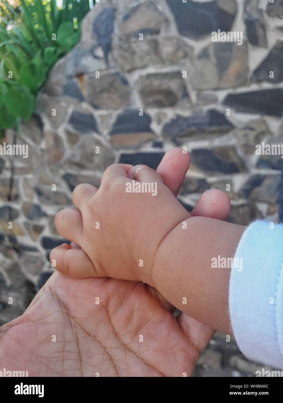 Baby fingers hi-res stock photography and images - Alamy