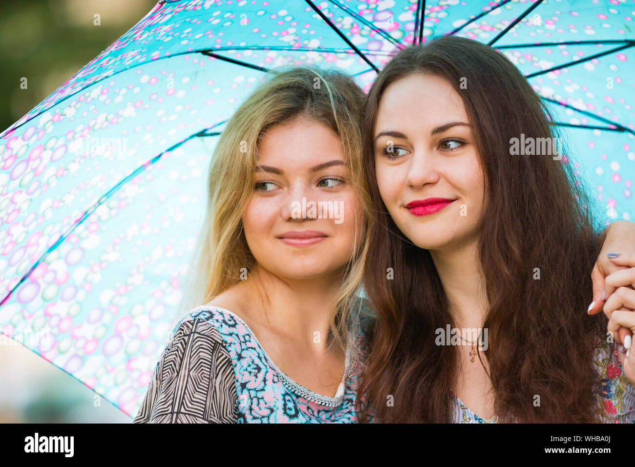 Two friends with umbrella hi-res stock photography and images - Alamy