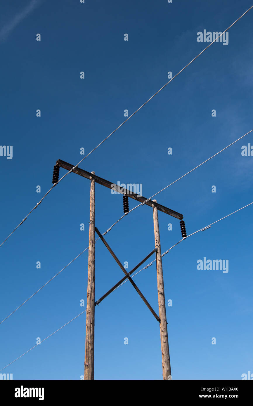 A power line cutting through the desert Stock Photo - Alamy
