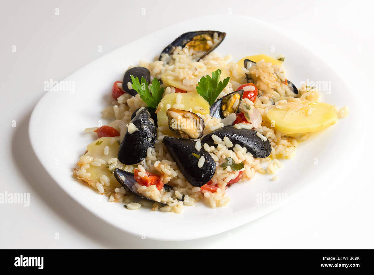 Rice, potatoes and mussels, traditional apulian dish, Bari cuisine ...