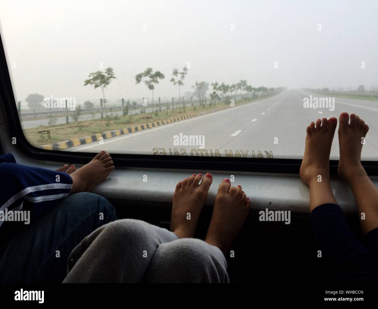 Feet car window hi-res stock photography and images - Alamy