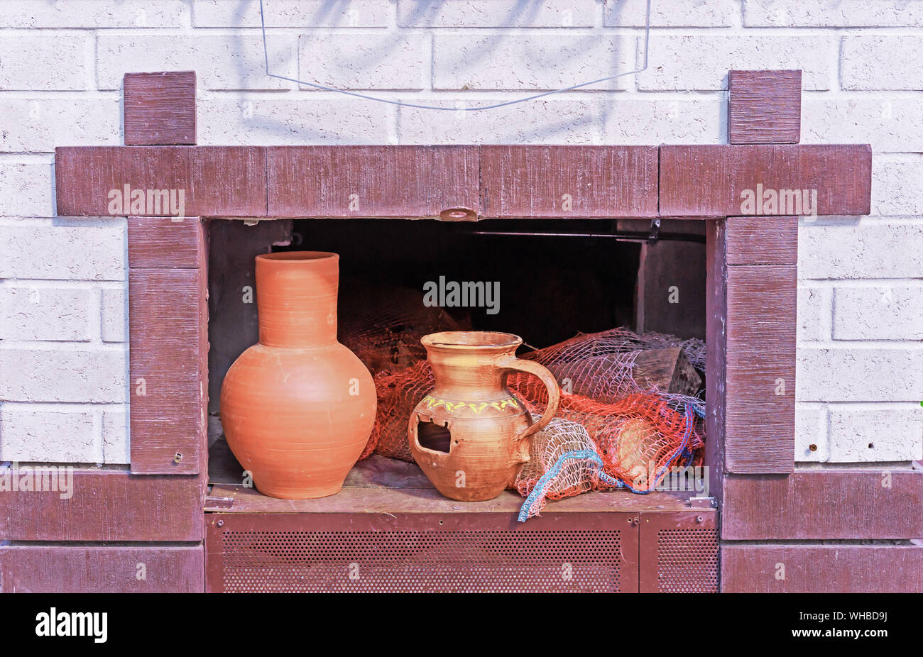 Russian wood stove with clay jugs and firewoods Stock Photo - Alamy