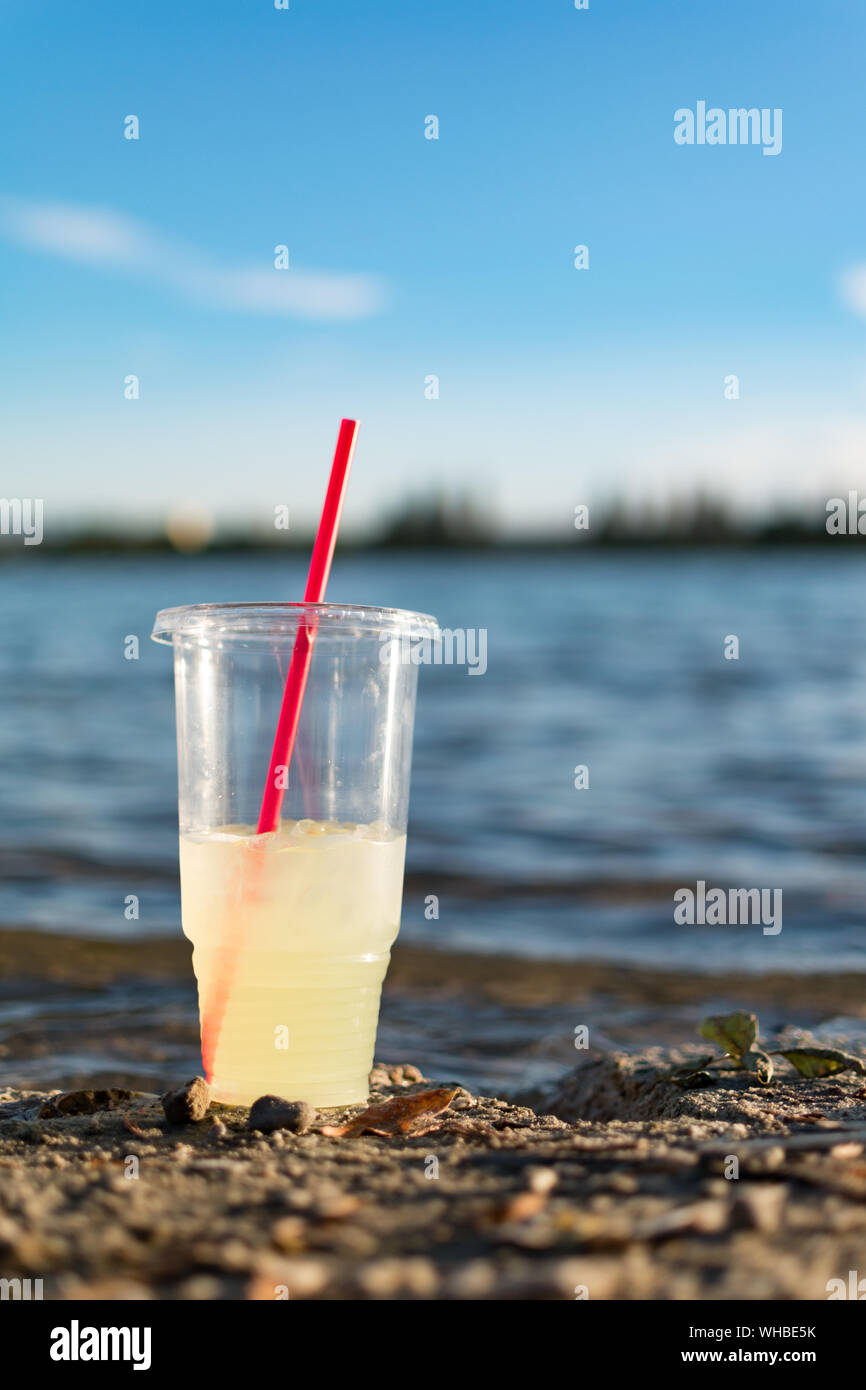 A cup of lemonade on the beach Stock Photo - Alamy