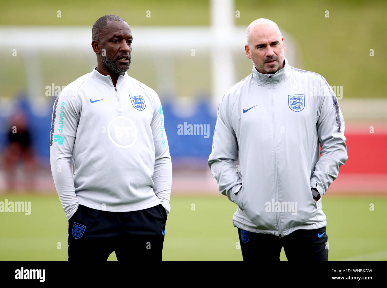 England coaching staff member Chris Powell (left) during a training ...
