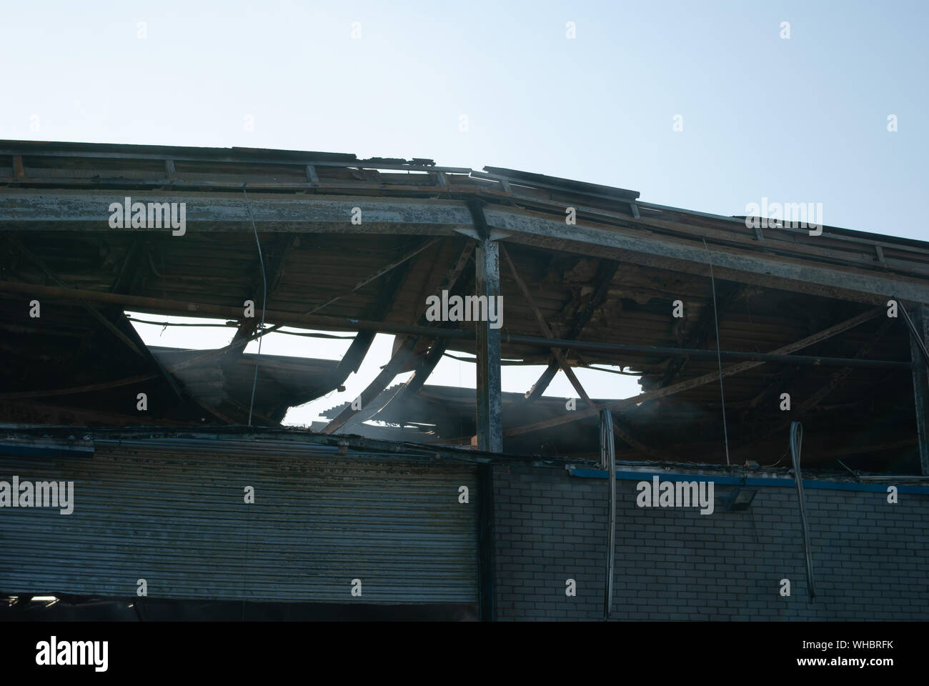 Fire-damaged industrial factory shortly after the blaze showing detail ...