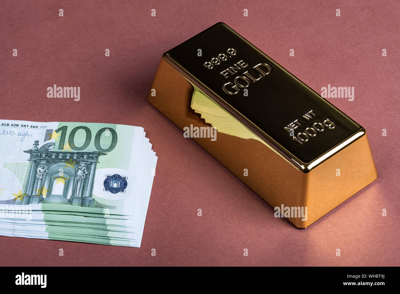 Euro cash and gold bar on a brown background. Banknotes. Money. Bill ...