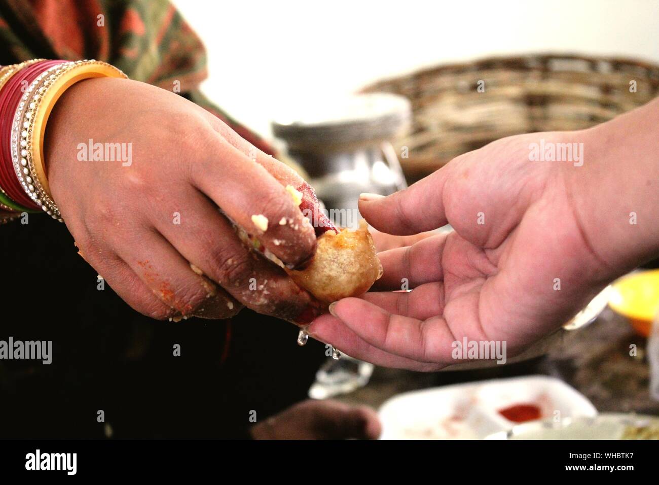 Woman giving food and drink hi-res stock photography and images - Alamy
