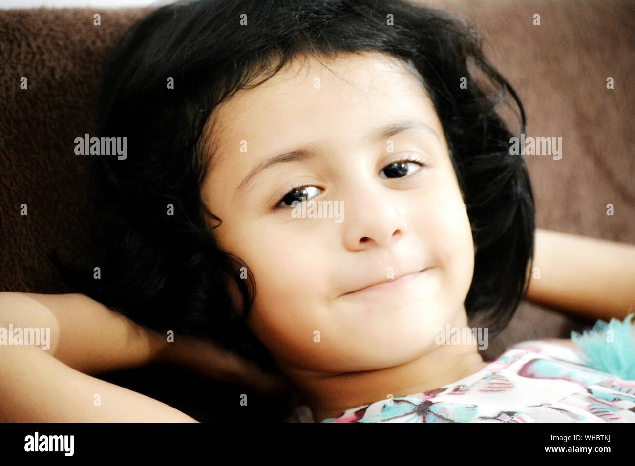 Girl lying on bed smiling hi-res stock photography and images - Alamy