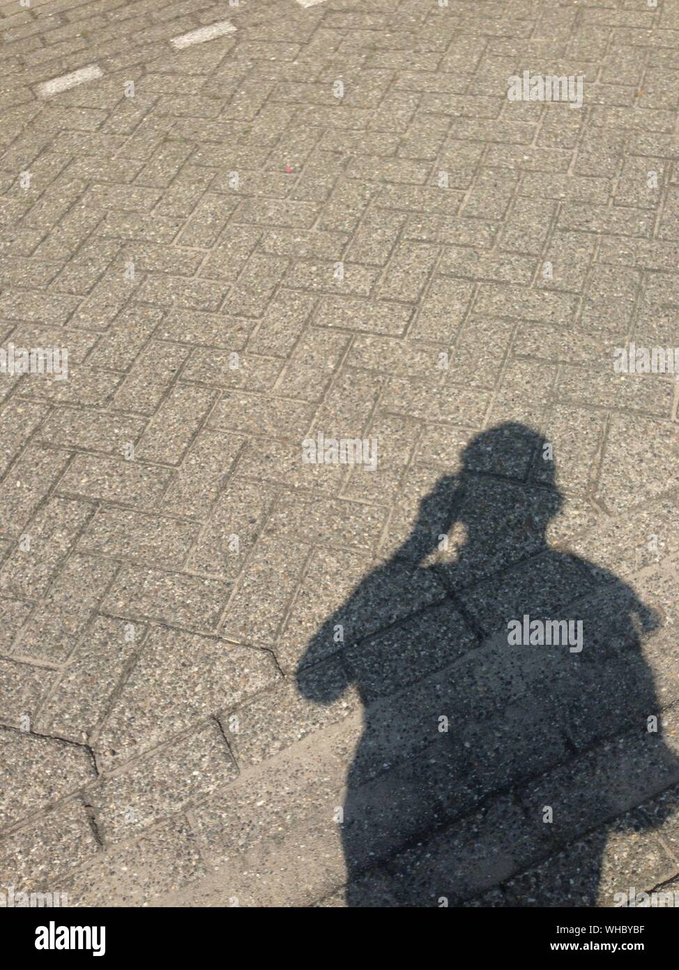 Shadow pavement man hi-res stock photography and images - Alamy