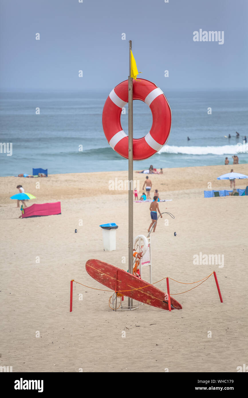 View of a beach with lifeguard lookout post, with lifebuoy and ...