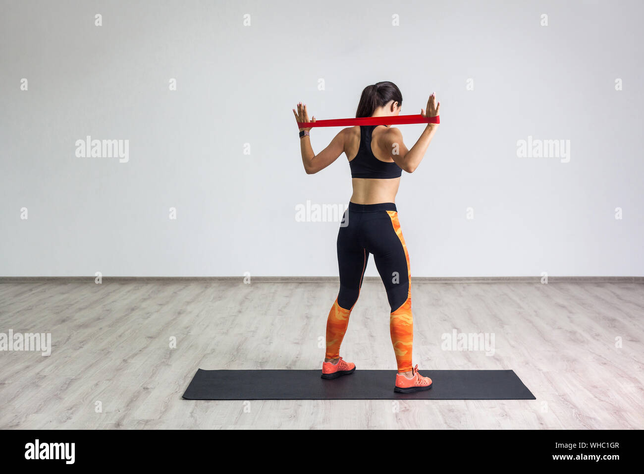 Full length back side portrait of sporty woman wearing in black top and ...