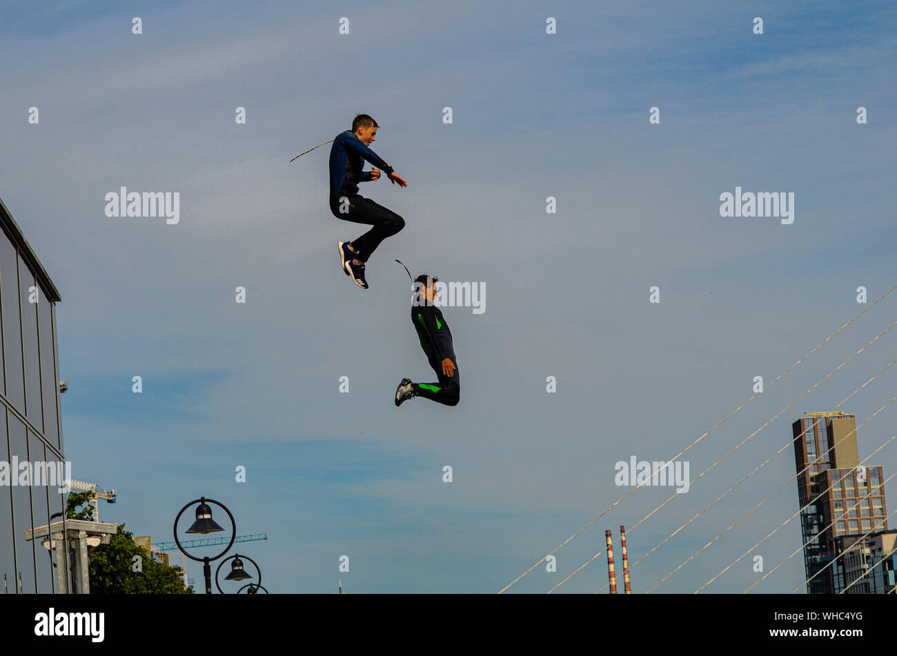 Guys having fun during the irish summer jumping to the Liefy River ...