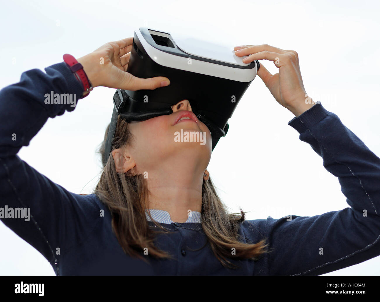 little girl with virtual reality visor on white background Stock Photo - Alamy