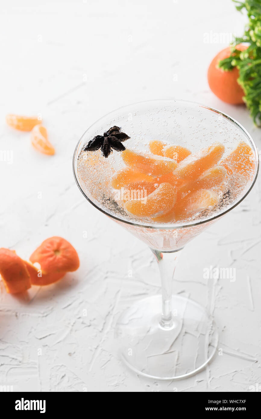 Christmas alcoholic cocktail with tangerines, vodka and star anise ...