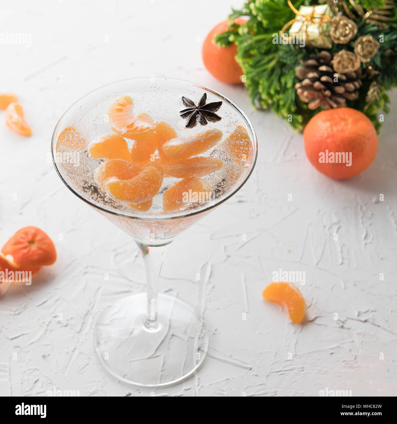Christmas alcoholic cocktail with tangerines, vodka and star anise ...