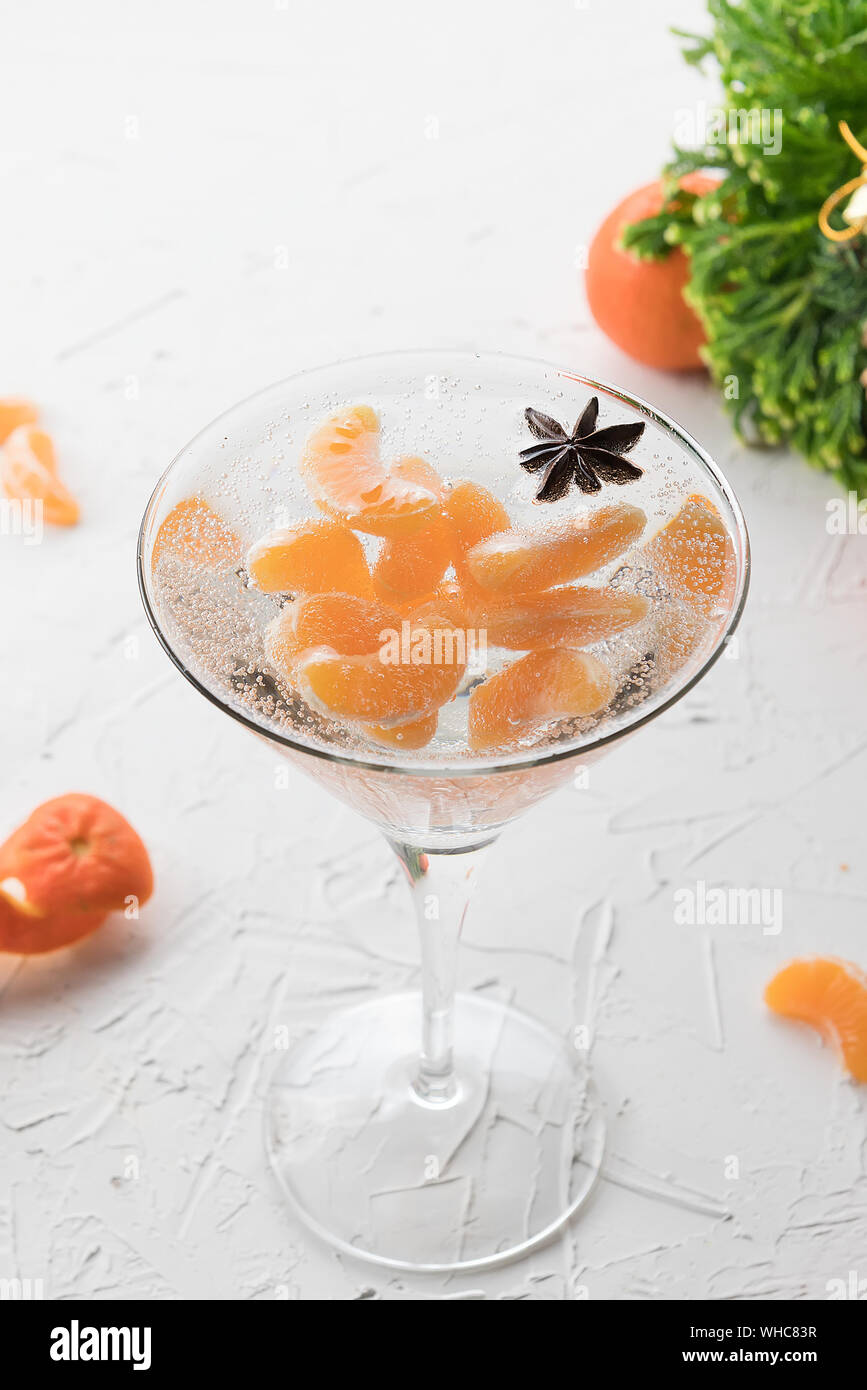 Christmas alcoholic cocktail with tangerines, vodka and star anise ...