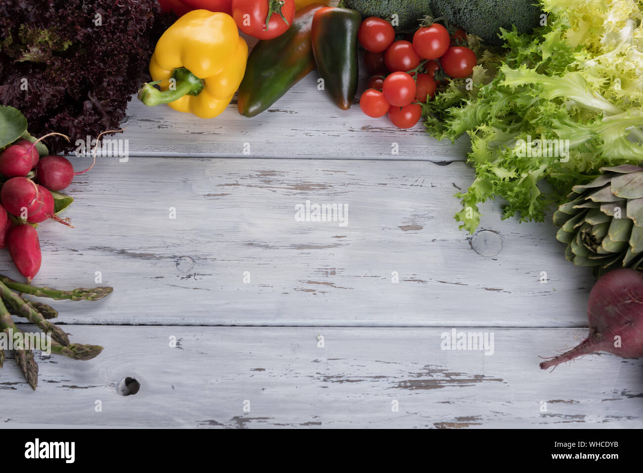 Organic food background, fresh vegetables old light wooden shabby ...