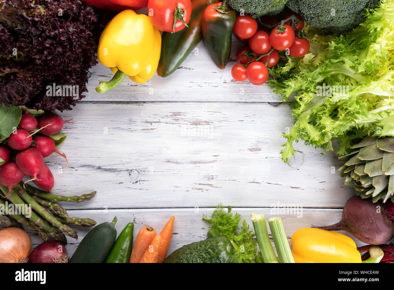 Organic food background - frame, fresh vegetables old light wooden ...