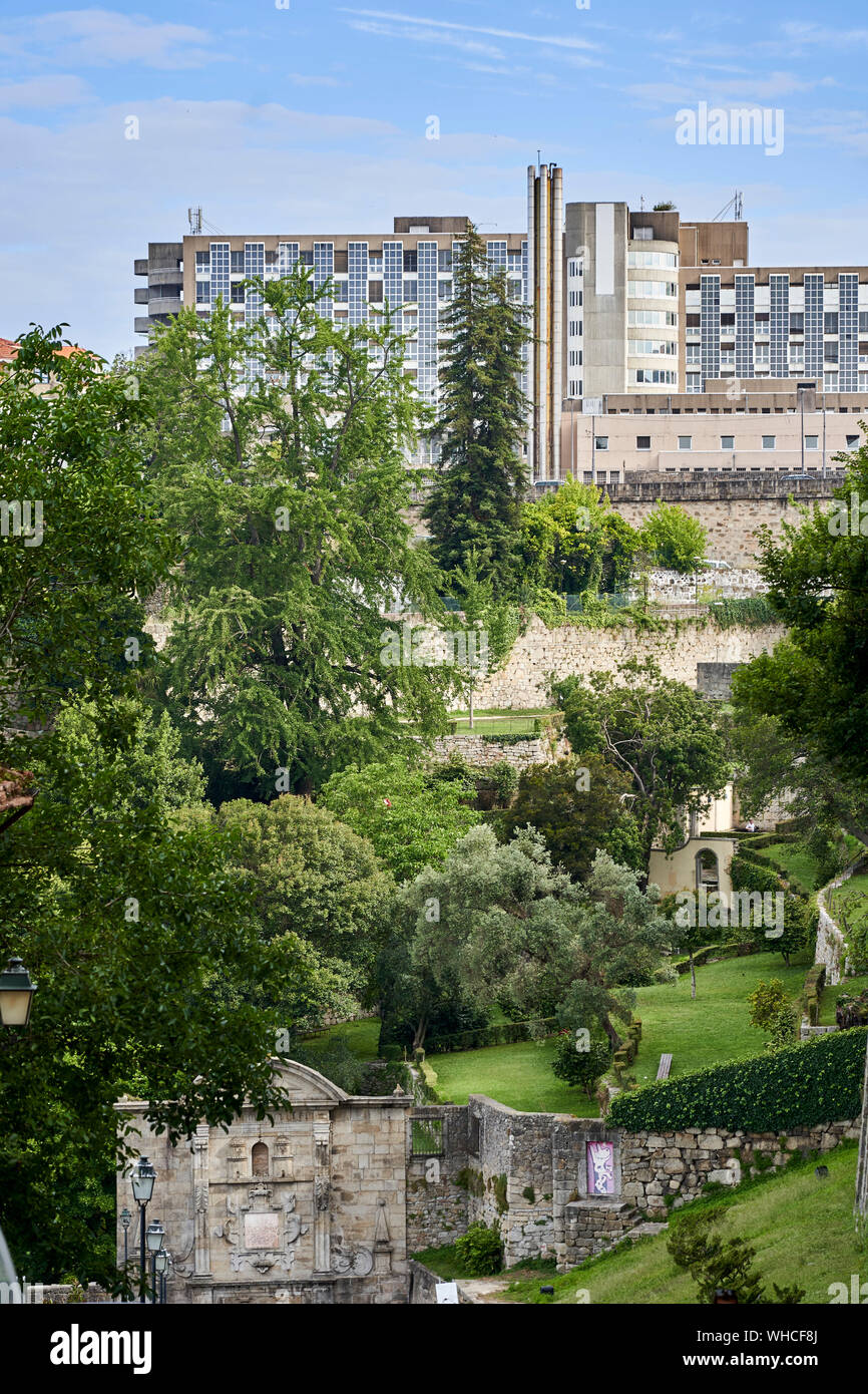 Garden with modern apartment block on hill Stock Photo - Alamy