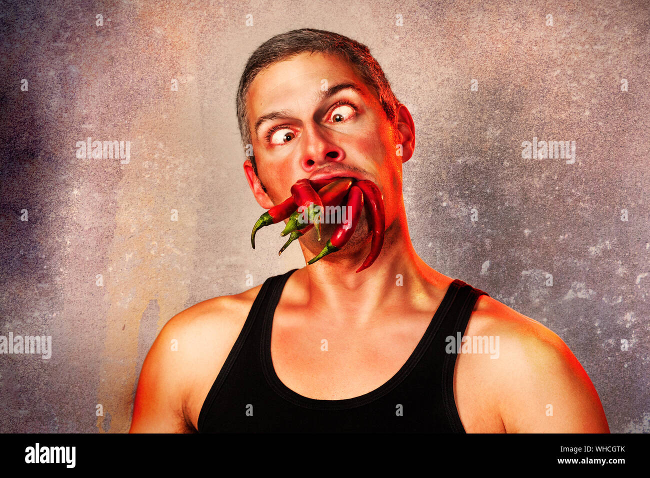 Man eating chili pepper hi-res stock photography and images - Alamy