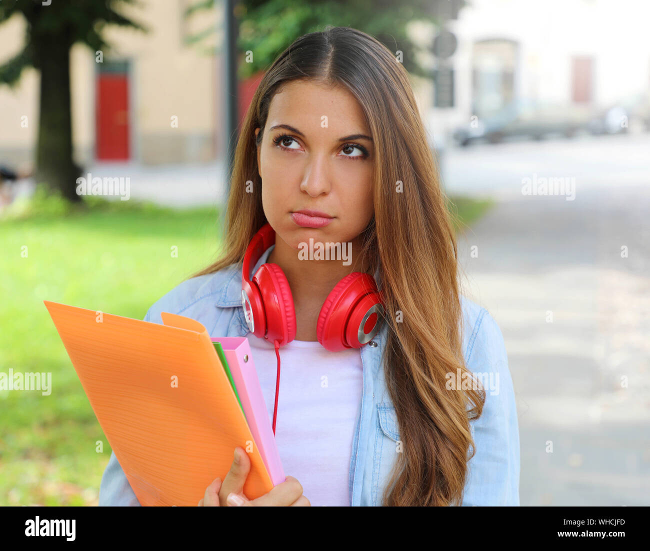 Student girl sad for back to school. Outdoors portrait of unhappy young ...