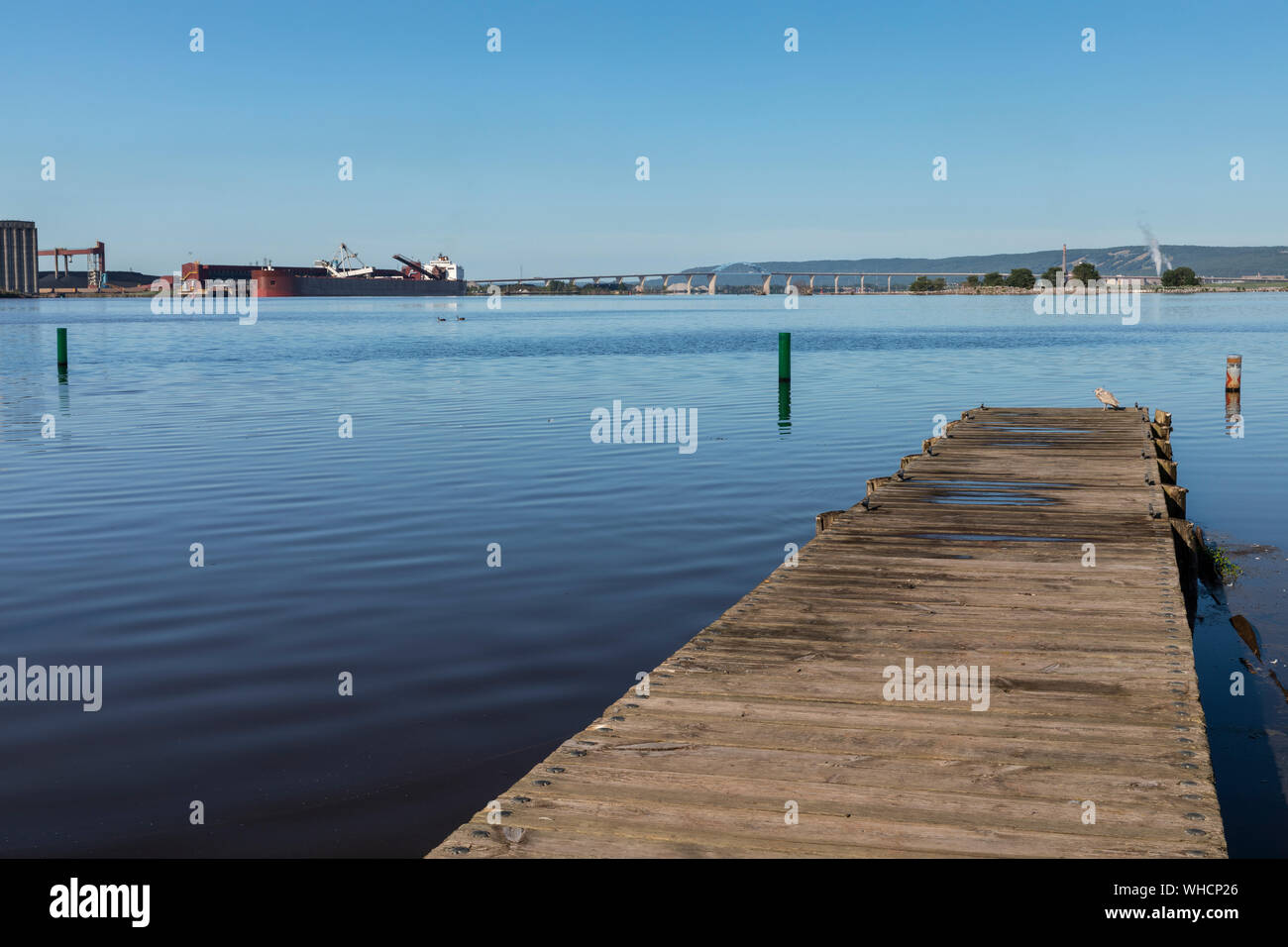 A commercial shipping harbor with a boat dock Stock Photo - Alamy