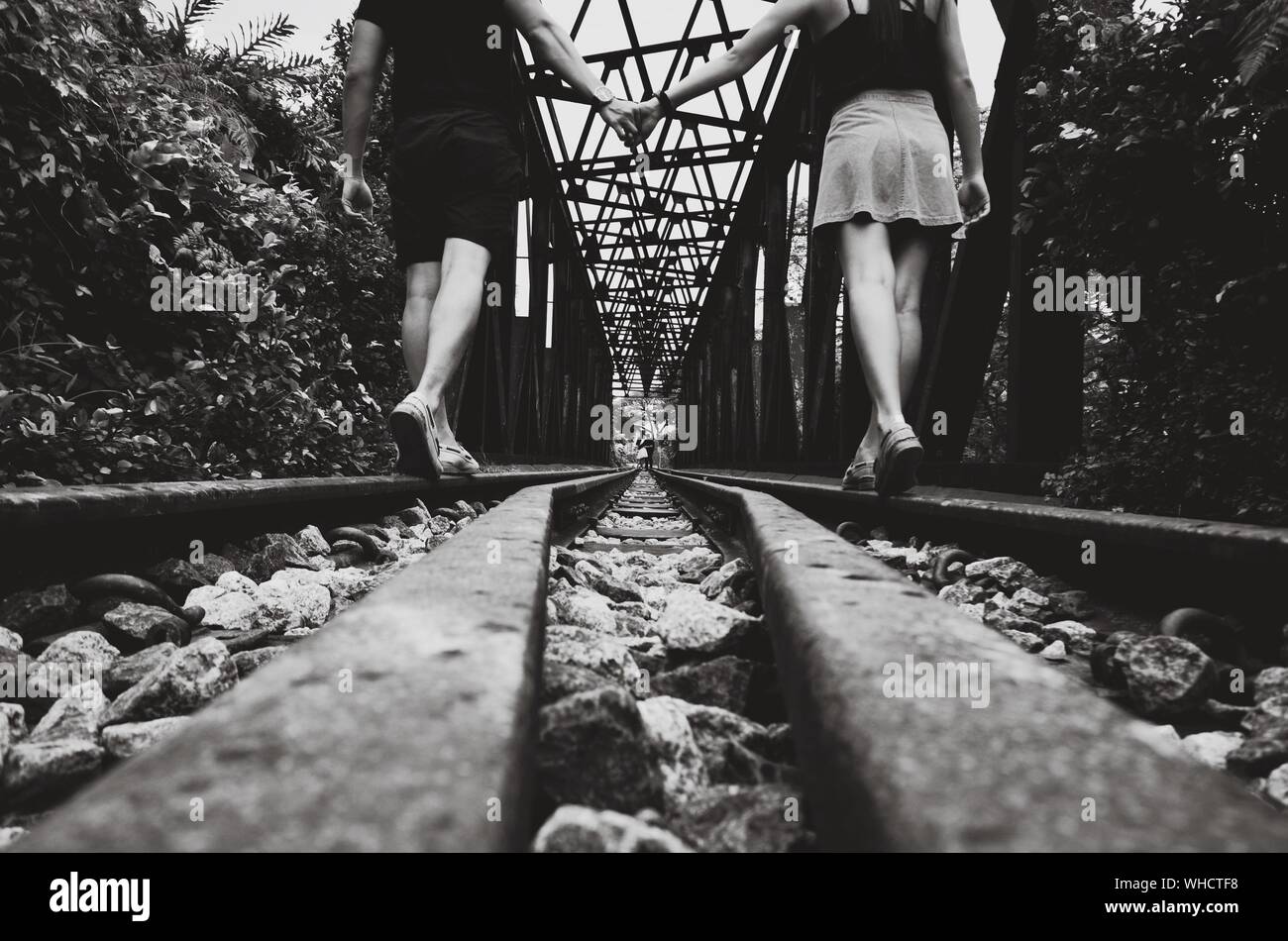 Couple walking on railroad tracks hi-res stock photography and images ...