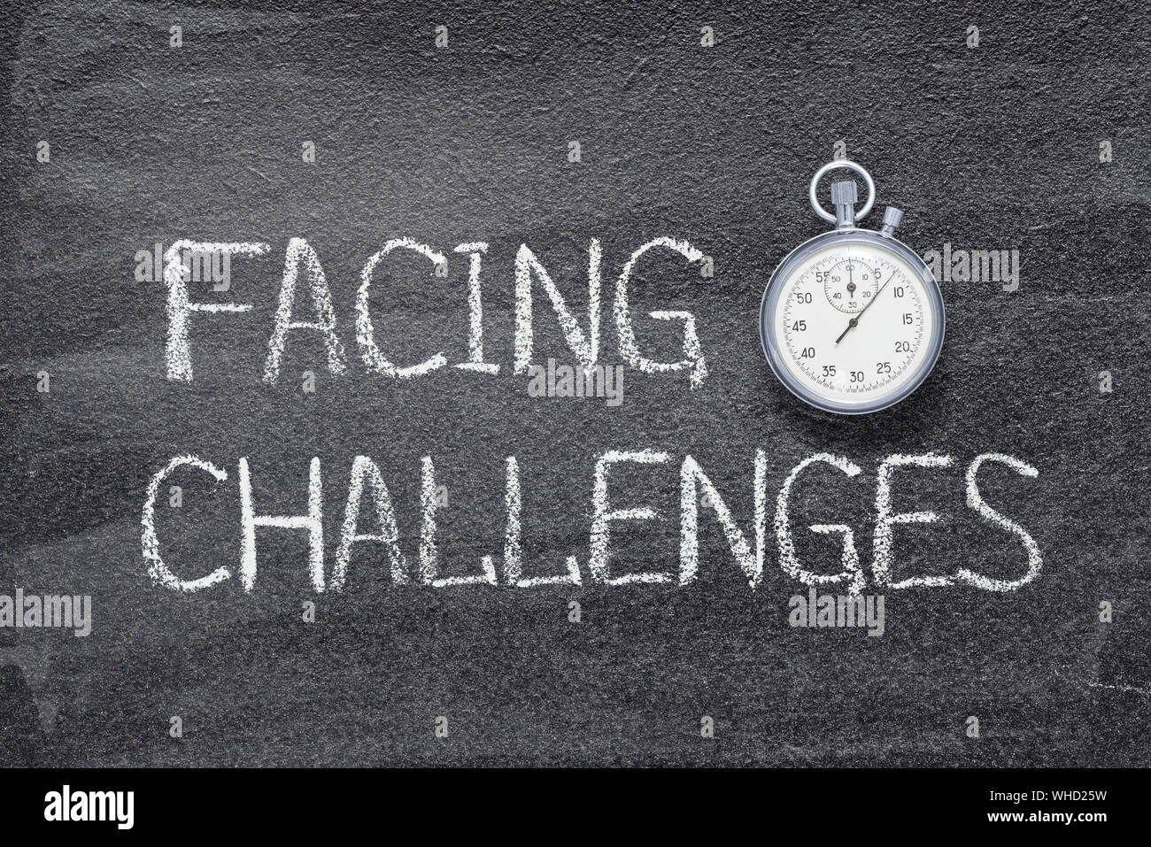 facing challenges phrase written on chalkboard with vintage precise ...