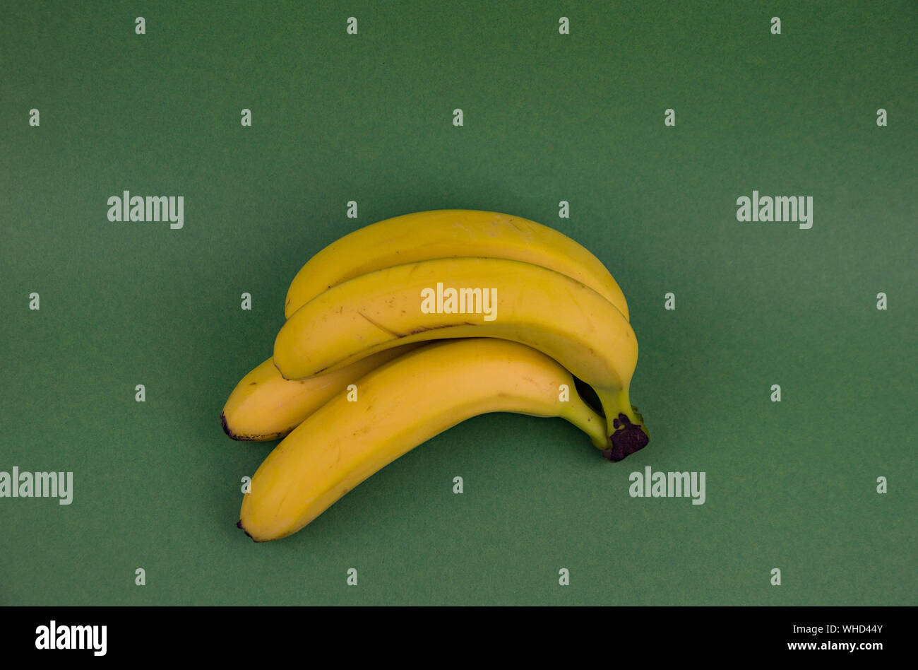 Yellow bananas on a green background, there is free space to fill Stock ...