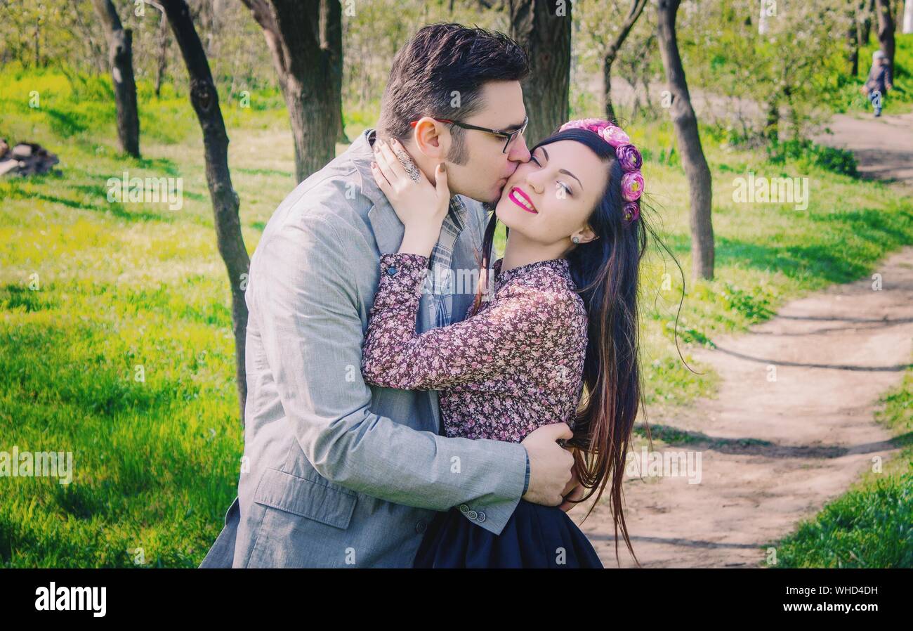 Young men kissing young woman hi-res stock photography and images - Alamy