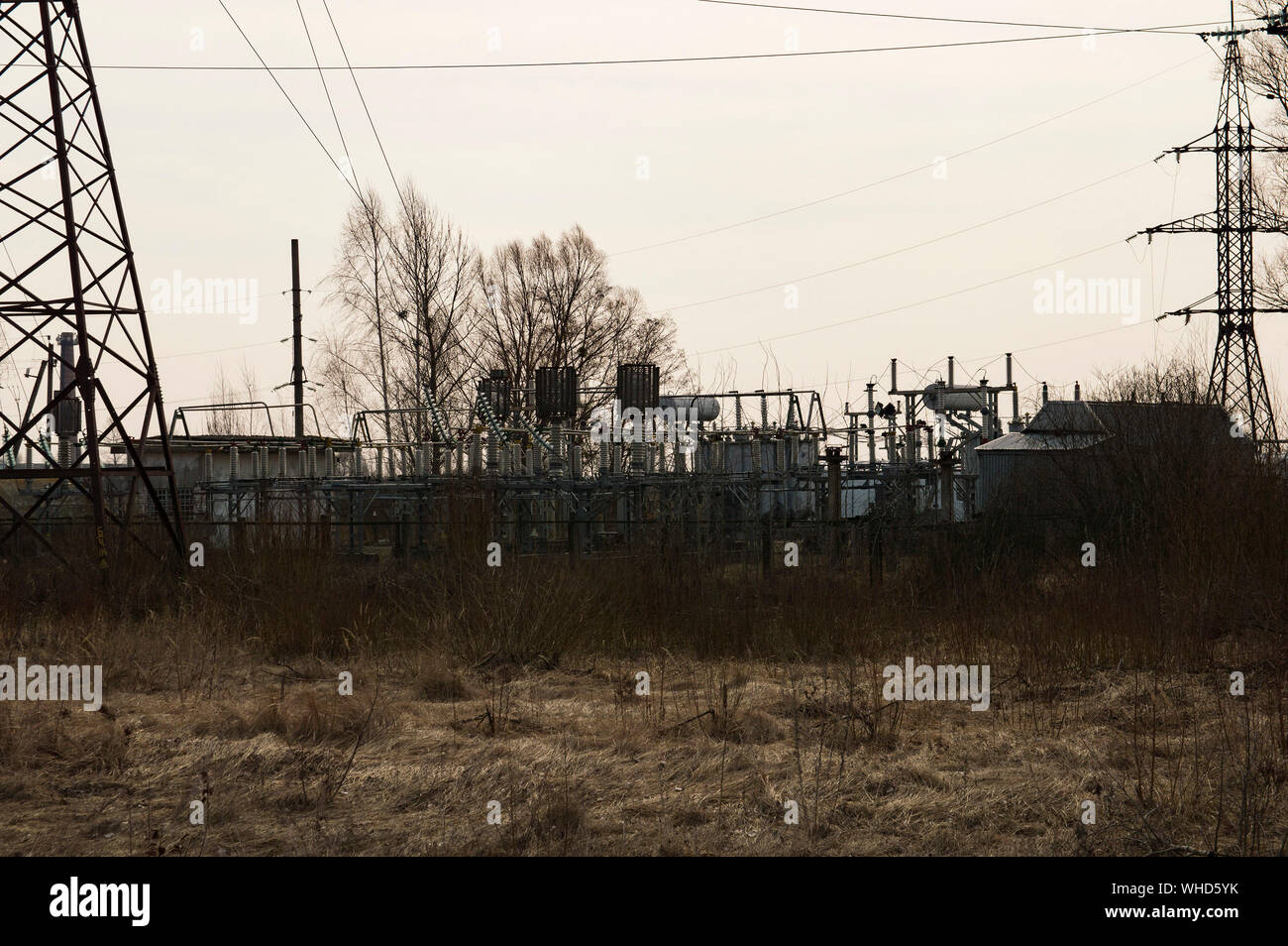 High-voltage power transmission line with substation and towers with ...